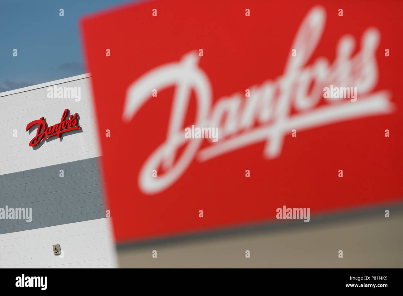 A logo sign outside of a facility occupied by The Danfoss Group in ...