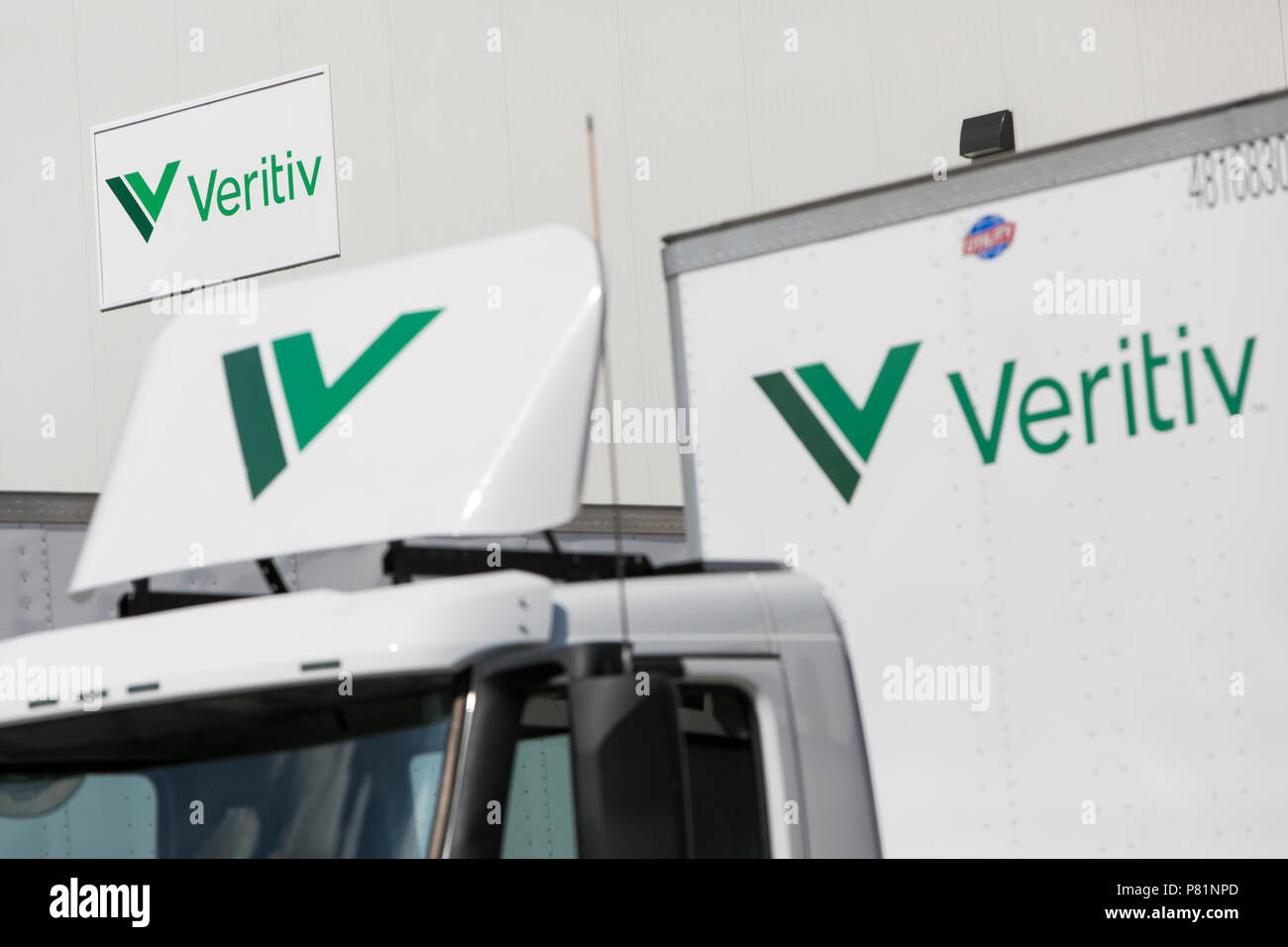 Semi-trucks and trailers featuring Veritiv Corporation logos outside of ...