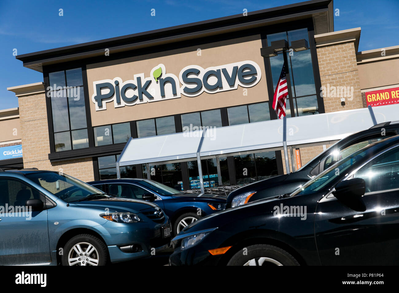 A logo sign outside of a Pick 'n Save retail grocery store in Racine ...