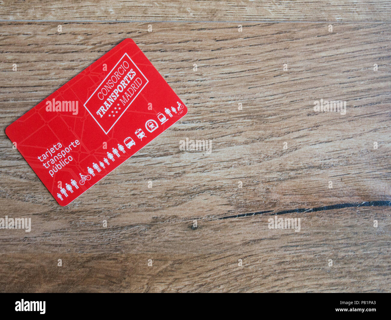 Madrid - Spain, June 19 - 2018 Public transport card of Madrid on wood ...