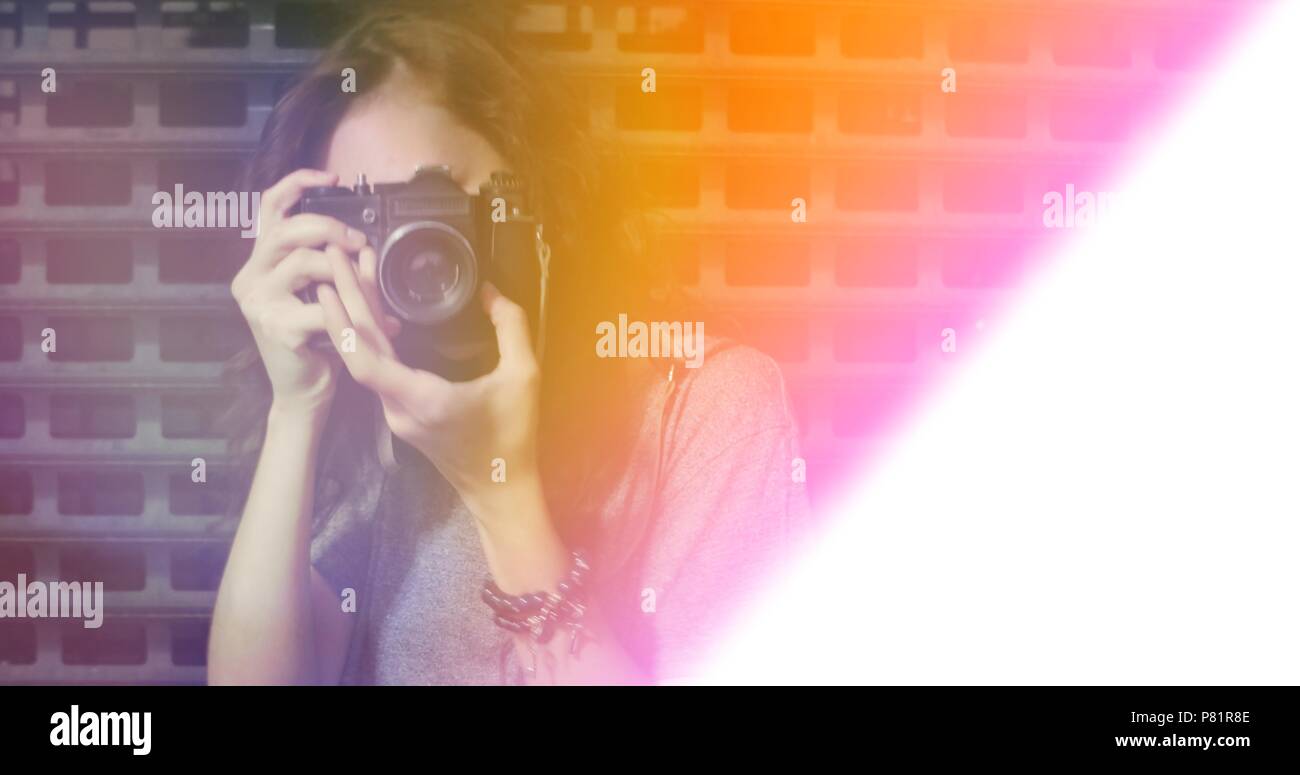 Bluury image of girl taking photo with light leak Stock Photo - Alamy