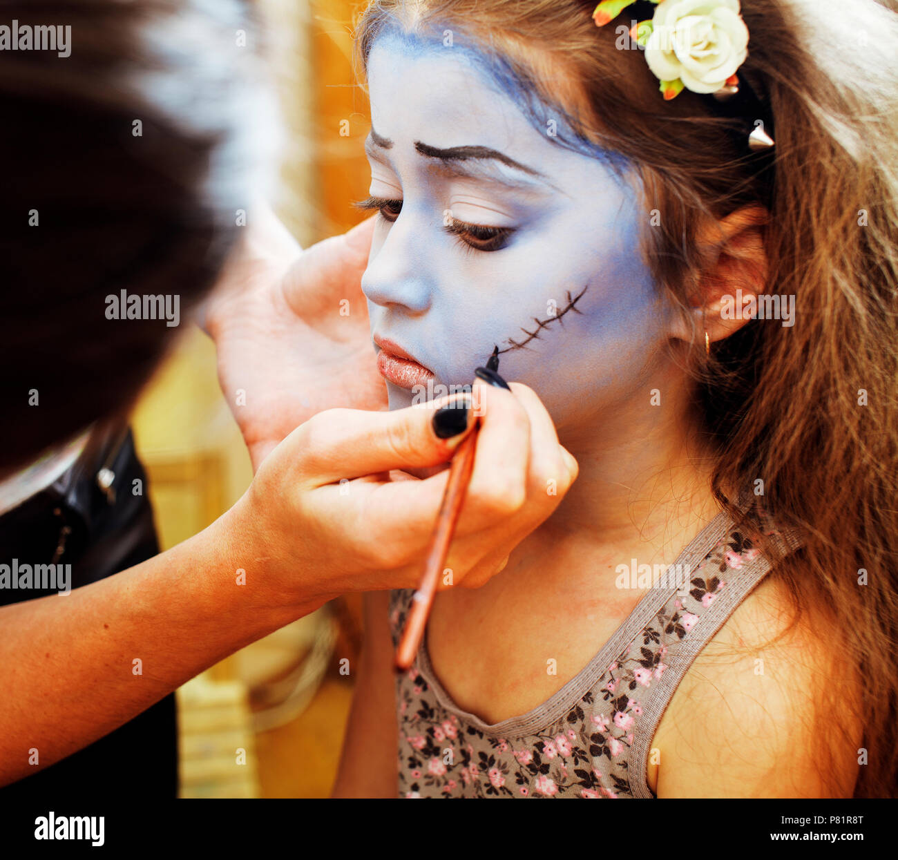little cute child making facepaint on birthday party, zombie Apo Stock ...