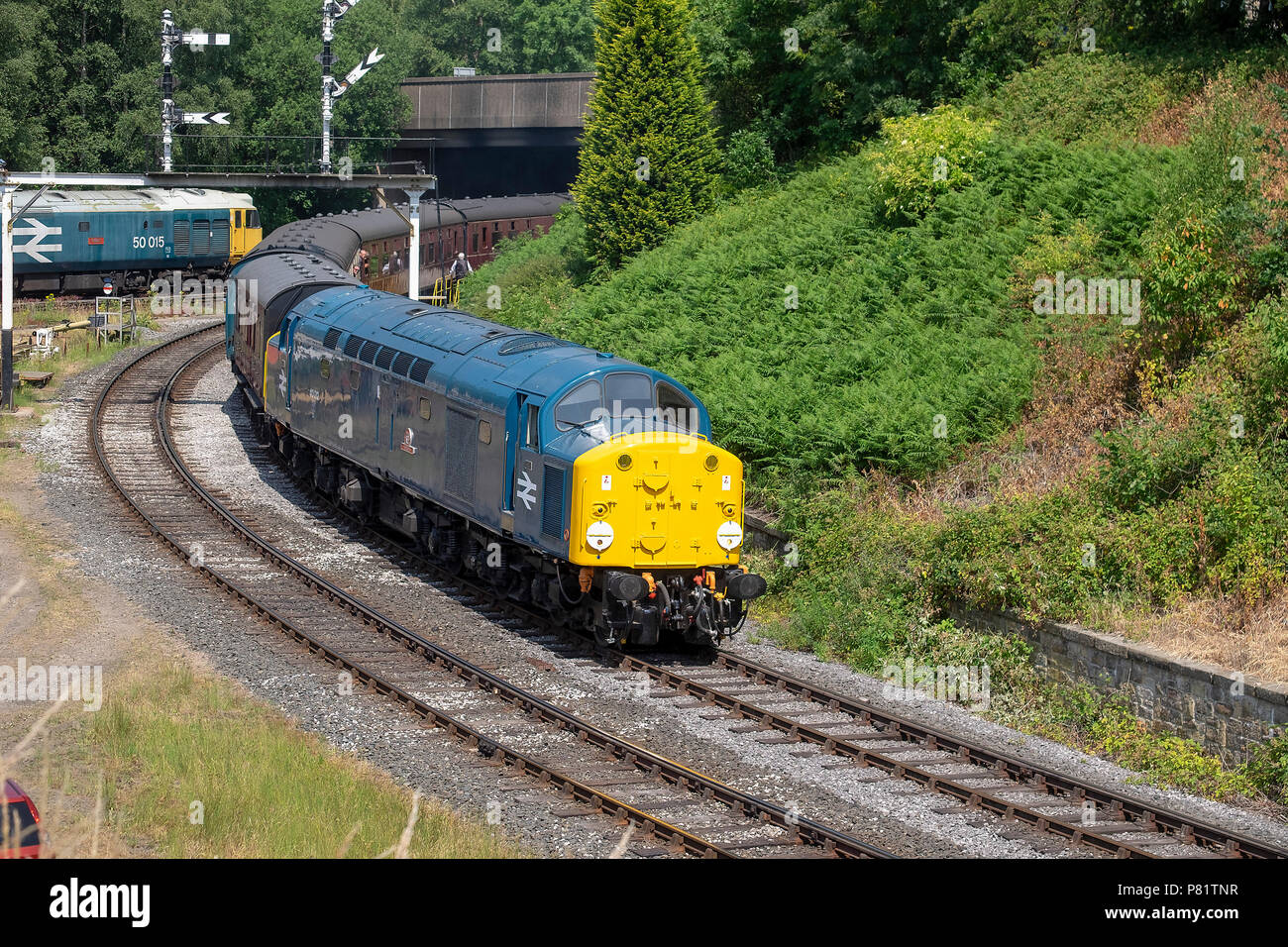 Diesel engine pulls passenger train Stock Photo - Alamy