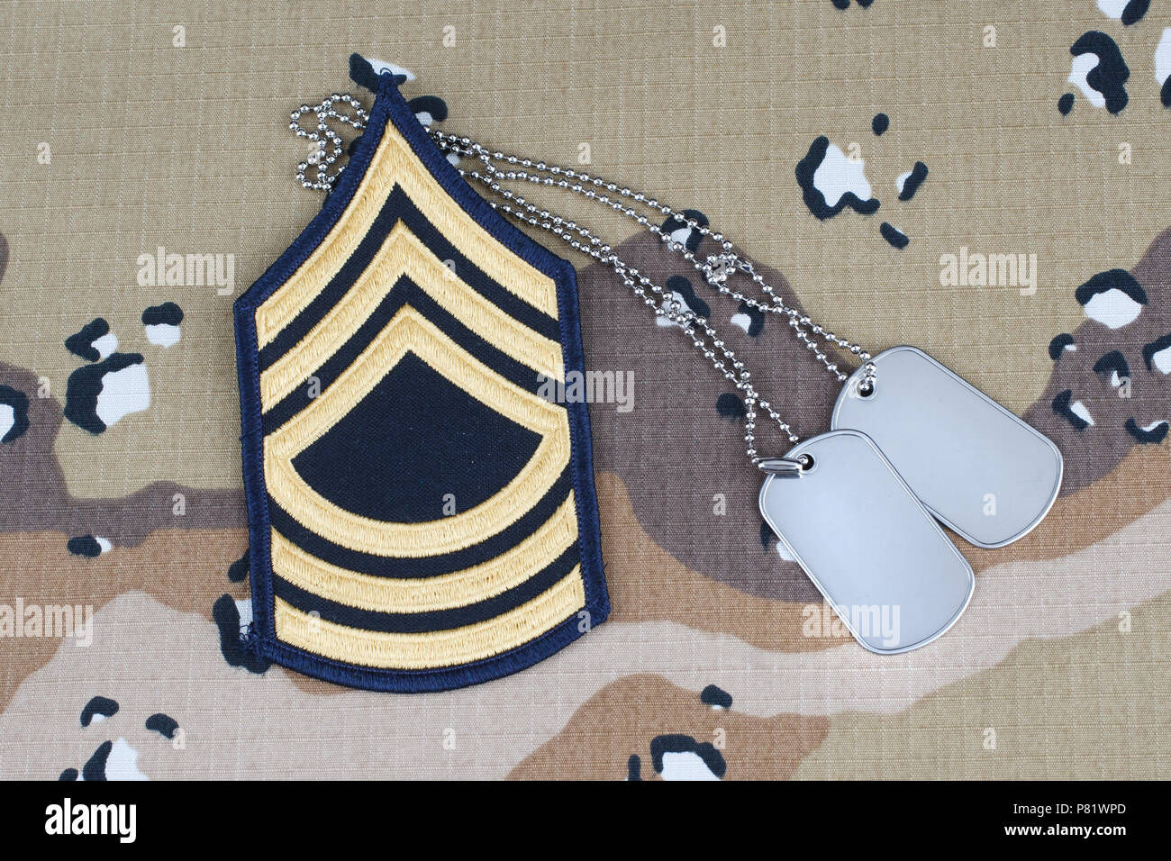 May 12, 2018. US ARMY Master Sergeant rank patch and dog tags on desert ...