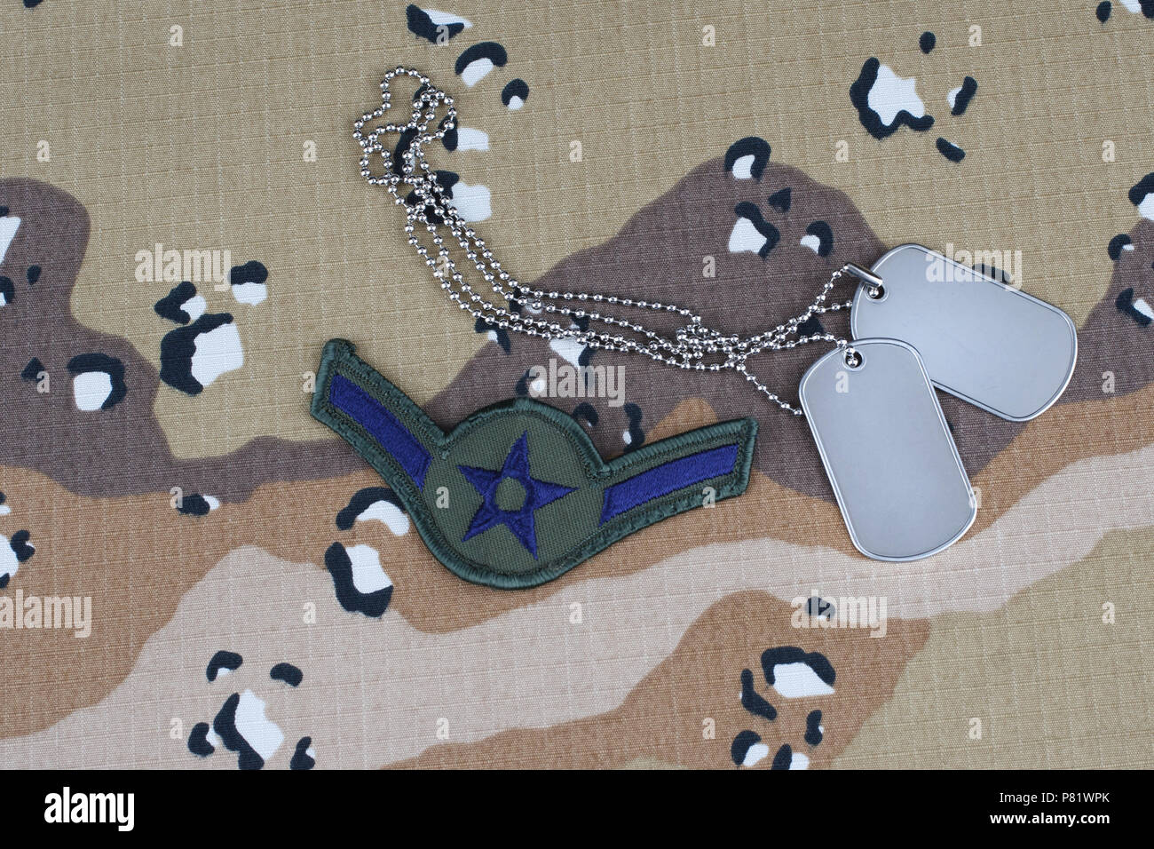 May 12, 2018. US AIR FORCE Airman rank patch and dog tags on desert ...