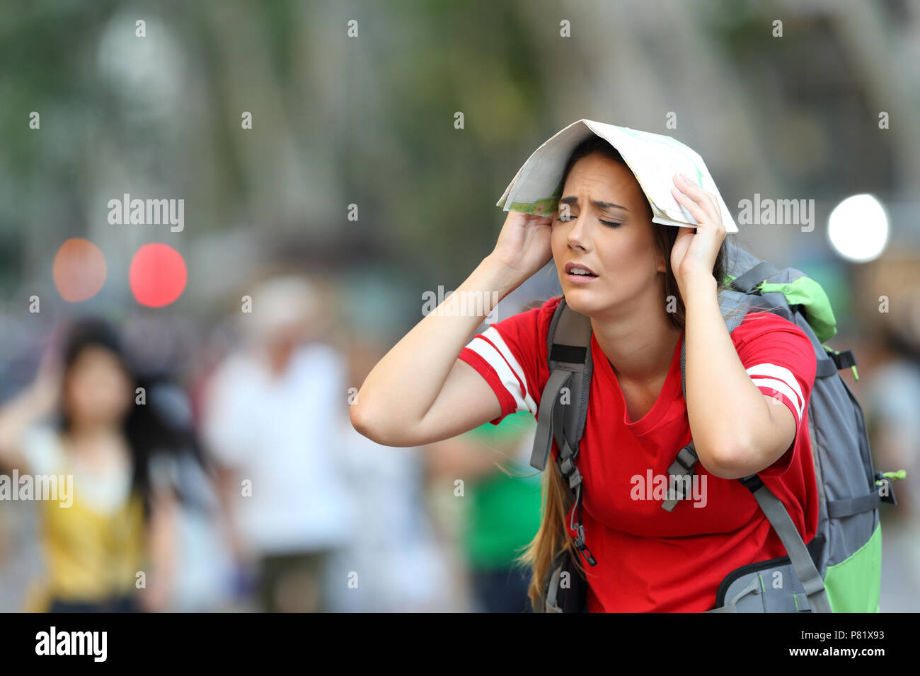 Tired teen tourist complaining walking in the street Stock Photo - Alamy