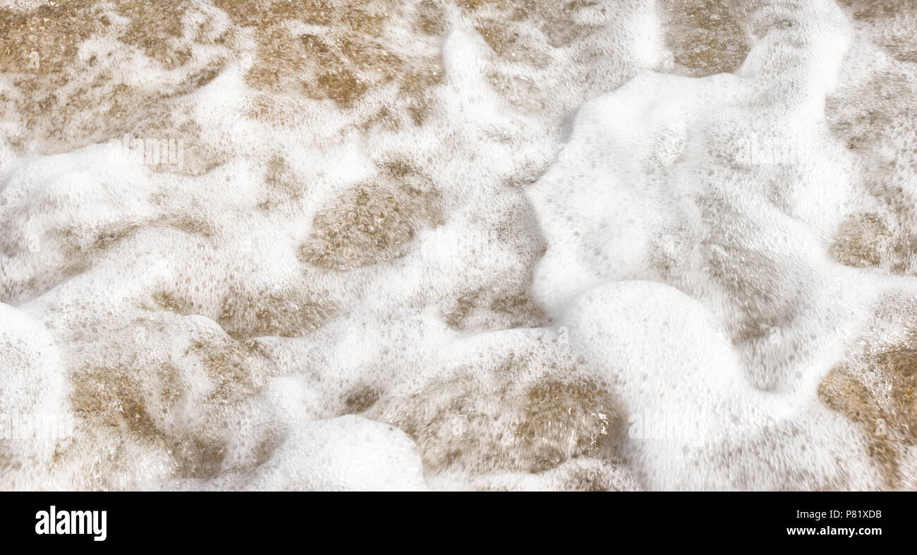Sea foam in the sand. Splashes of sea waves Stock Photo - Alamy