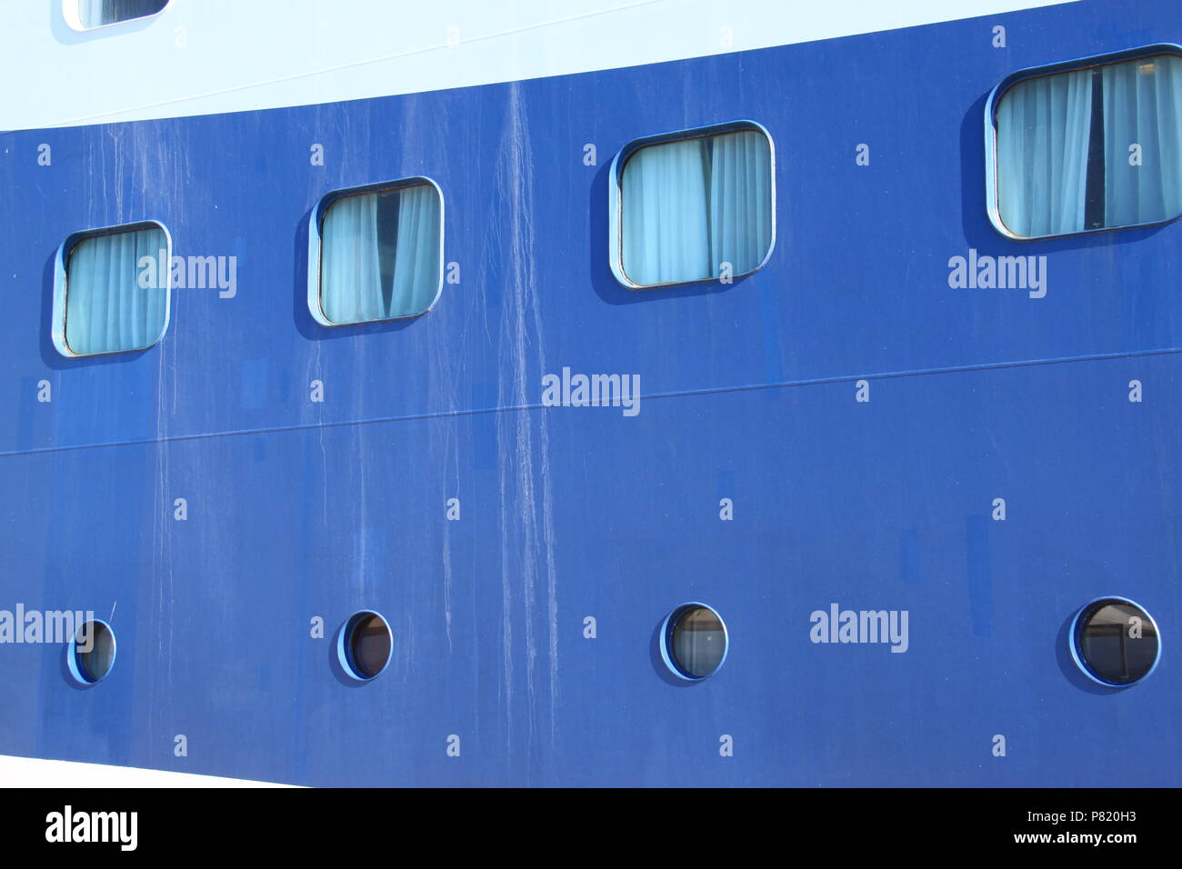 Side elevation of a cruise ship berthed in the new port at Corfu Town ...