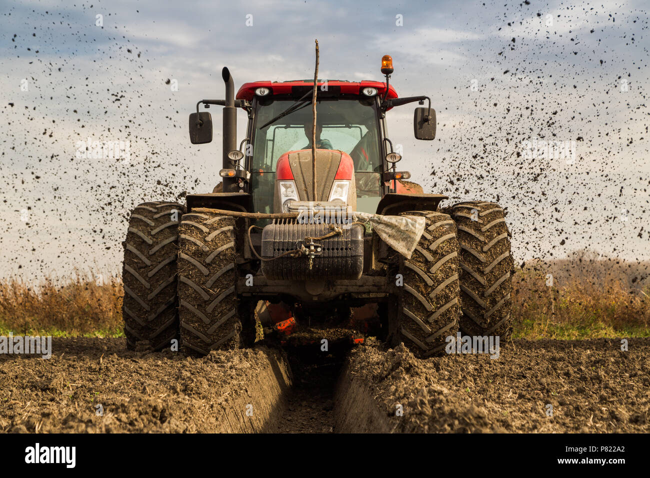 Tractor with double wheeled ditcher digging drainage canal Stock Photo ...