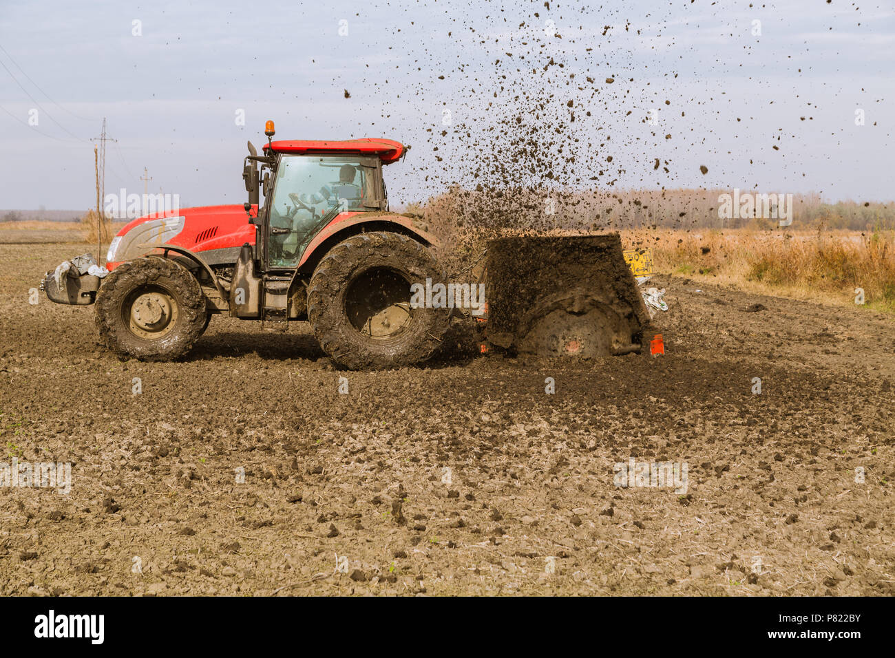 Tractor with double wheeled ditcher digging drainage canal Stock Photo - Alamy