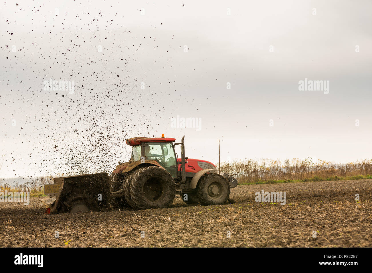 Tractor with double wheeled ditcher digging drainage canal Stock Photo ...