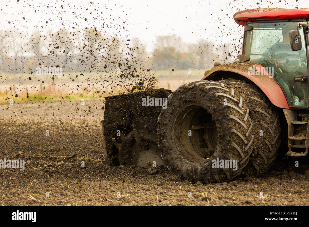 Tractor with double wheeled ditcher digging drainage canal Stock Photo - Alamy