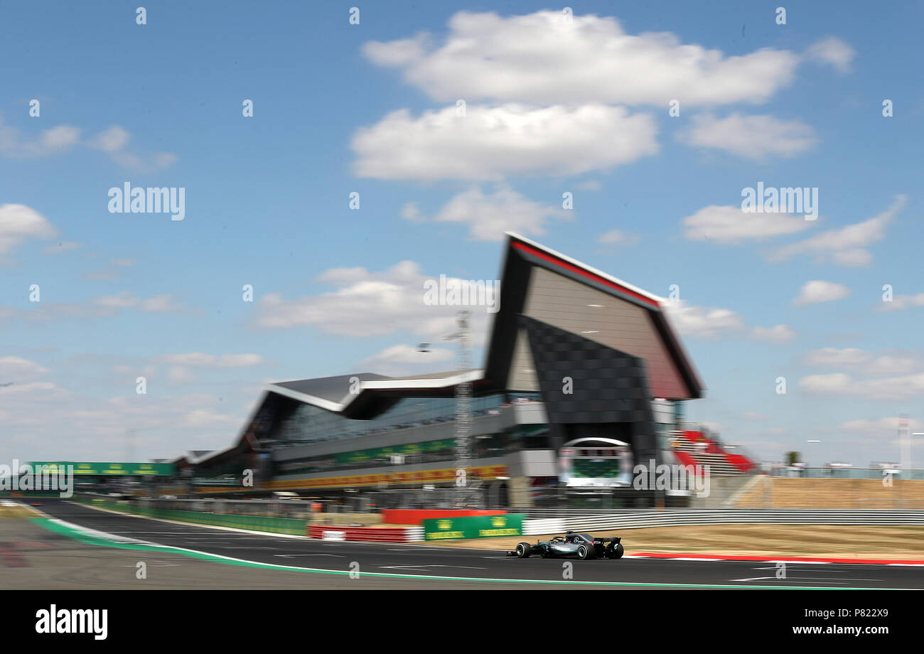 Mercedes' Lewis Hamilton drives past the grandstand during the 2018 ...