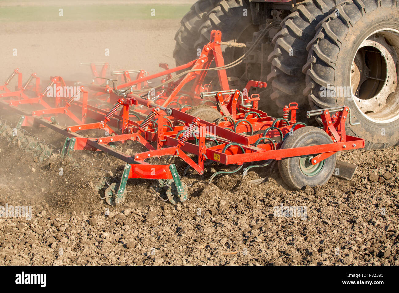 Close up shot of seedbed cultivator machine at work Stock Photo - Alamy