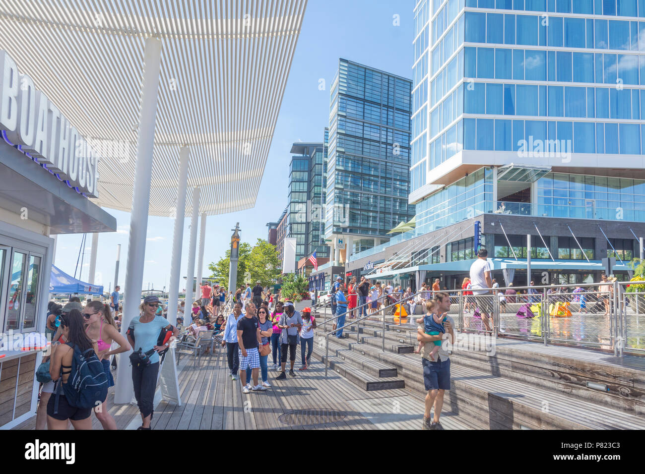 Visitors stroll along Water Street SW at the District Wharf in ...