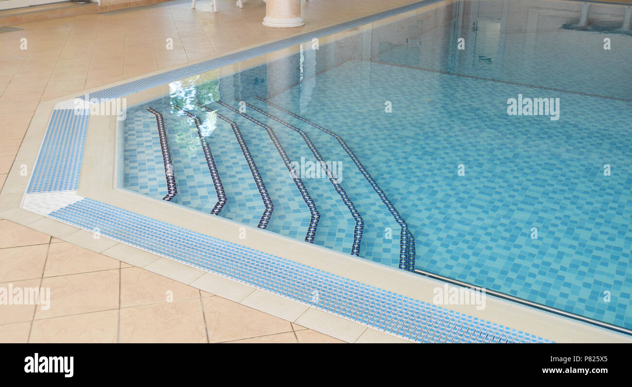 Luxury pool with steps down to the water Stock Photo - Alamy