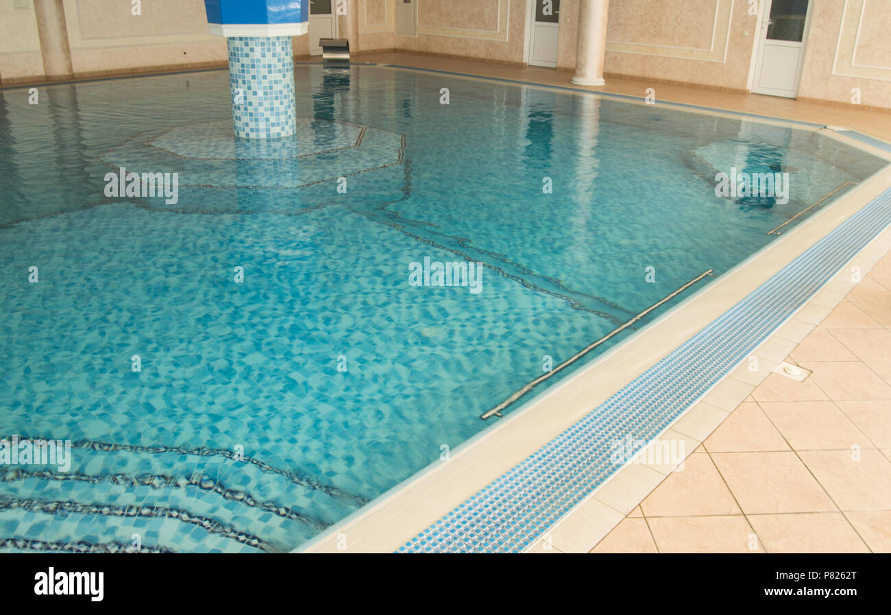 Luxury pool with steps down to the water Stock Photo - Alamy