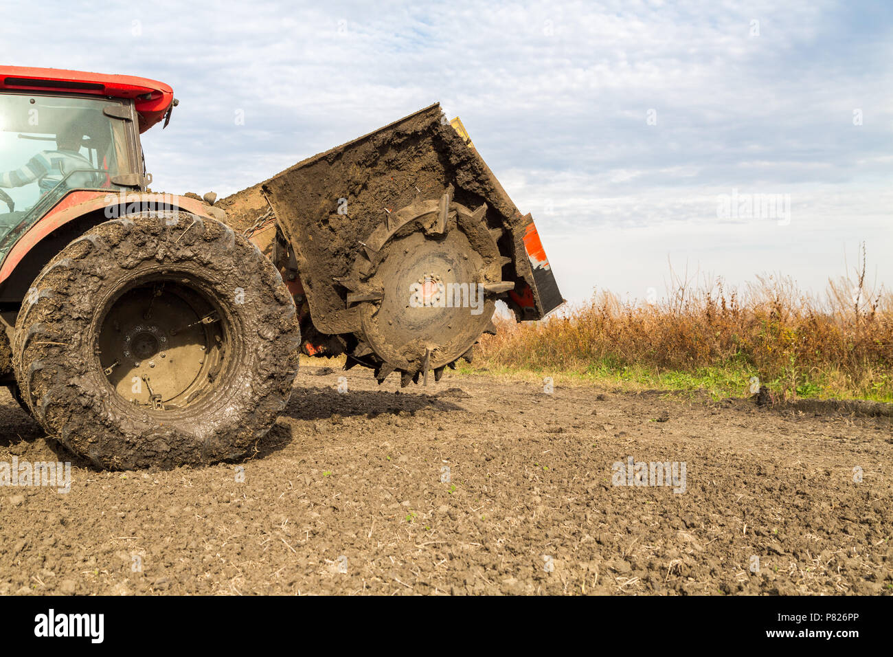 Tractor with double wheeled ditcher digging drainage canal Stock Photo ...
