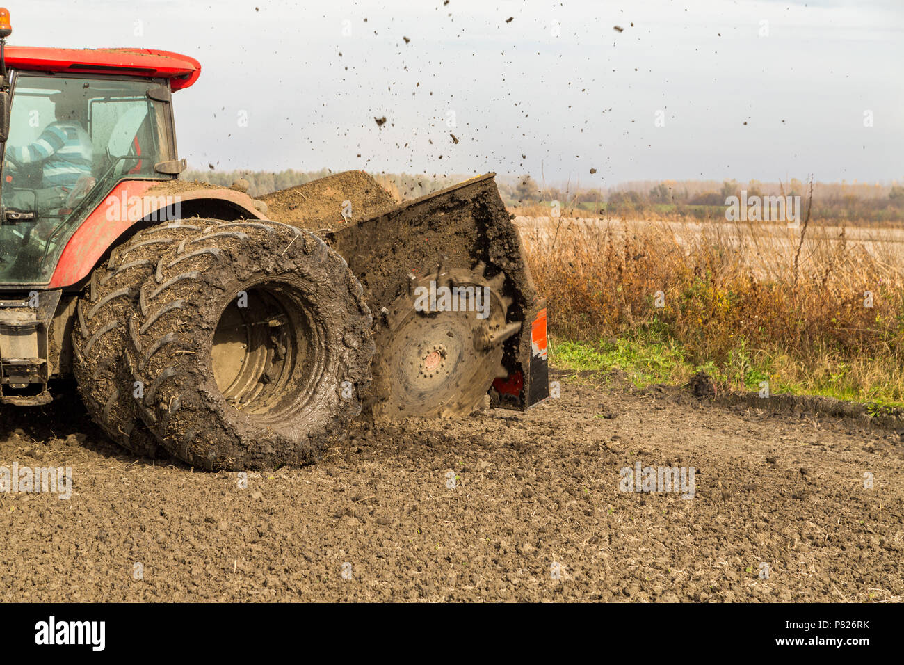 Tractor with double wheeled ditcher digging drainage canal Stock Photo ...