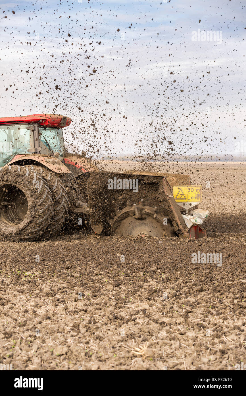 Tractor with double wheeled ditcher digging drainage canal Stock Photo ...