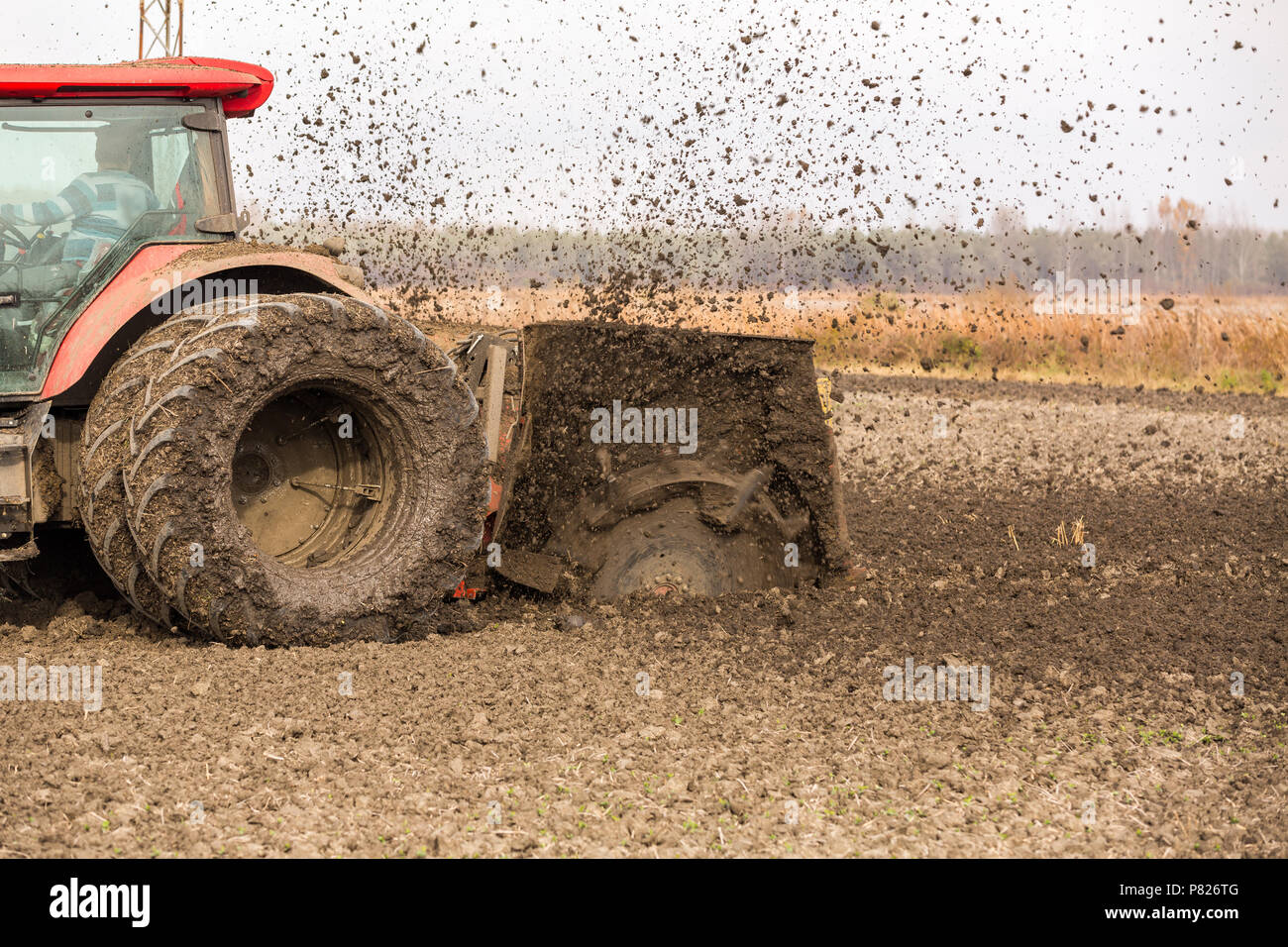 Tractor with double wheeled ditcher digging drainage canal Stock Photo ...