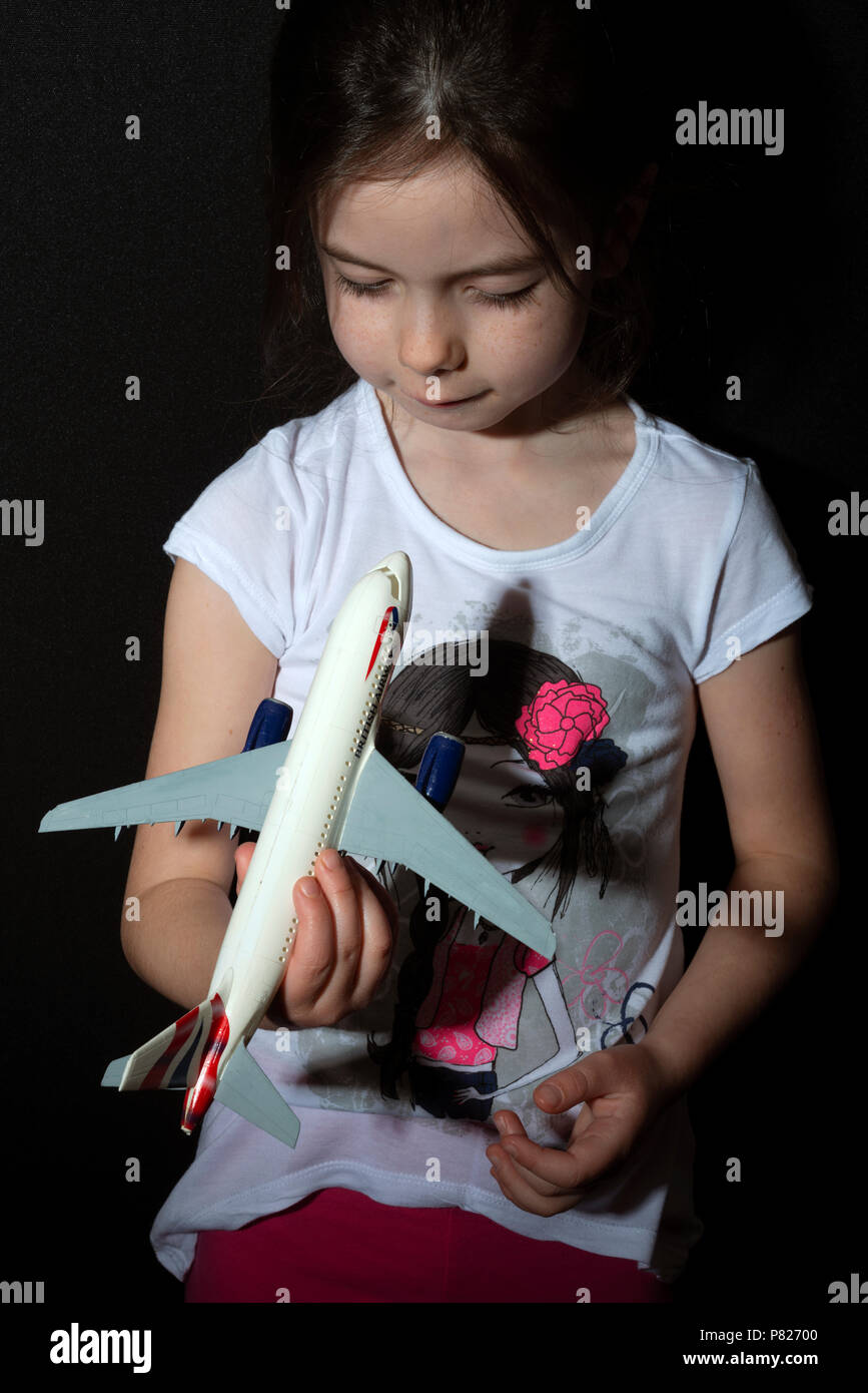 Girl holding a Airbus A319 scale model aircraft Stock Photo - Alamy