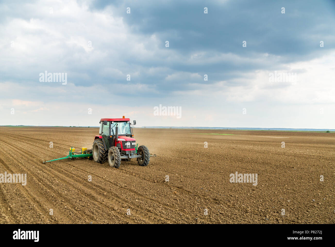 Farmer seeding, sowing crops at field Stock Photo - Alamy