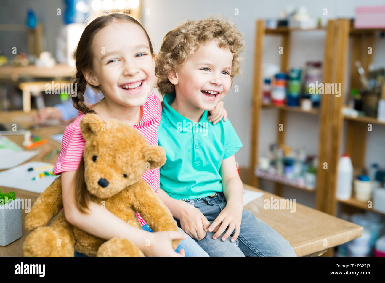 Happy Kids with Teddy Bear Stock Photo - Alamy