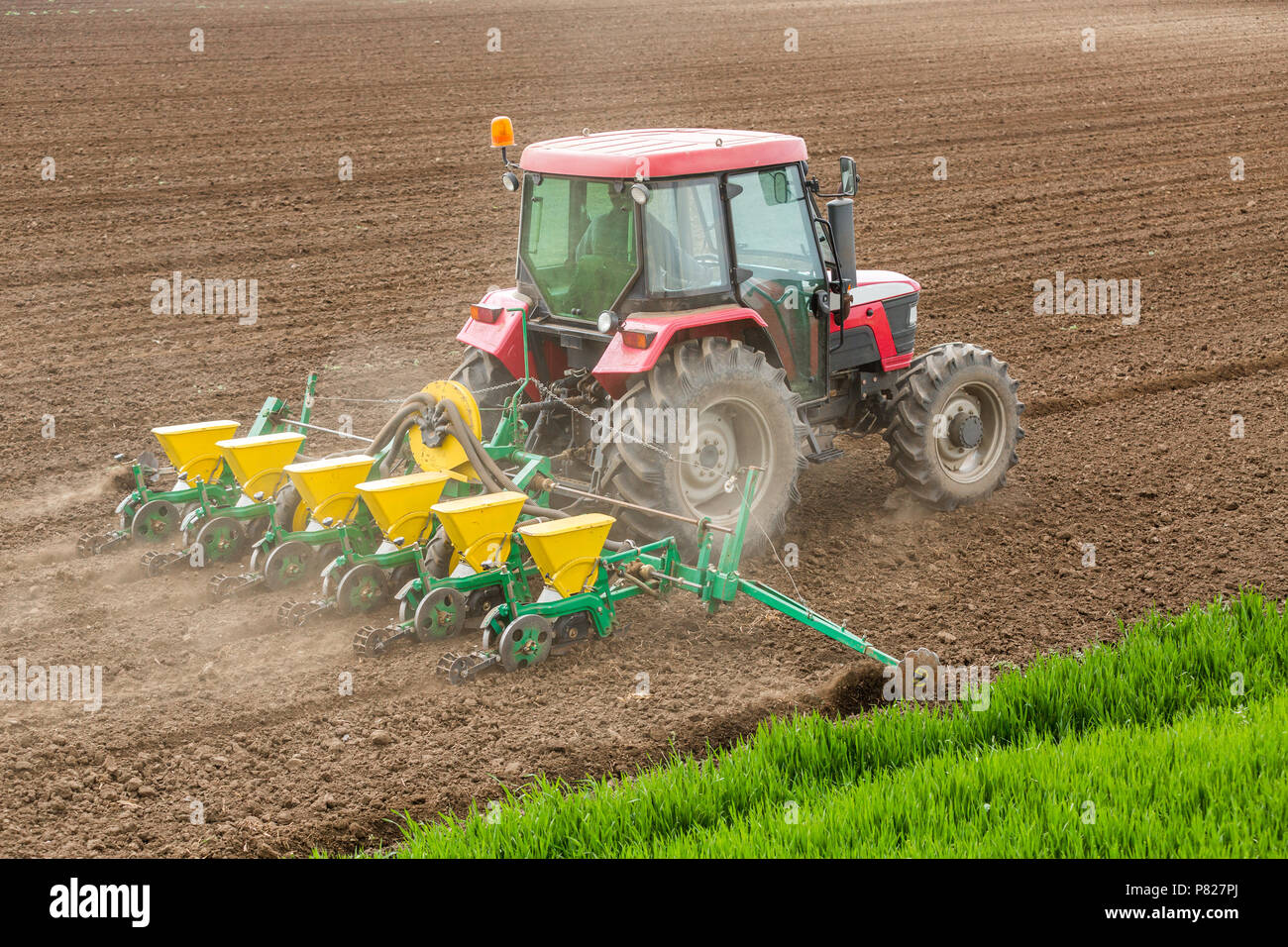 Farmer seeding, sowing crops at field. Sowing is the process of ...