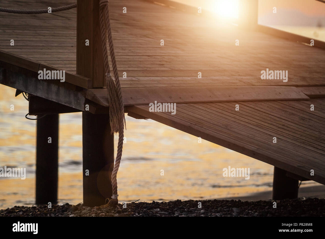 sun shining on wooden pier Stock Photo - Alamy