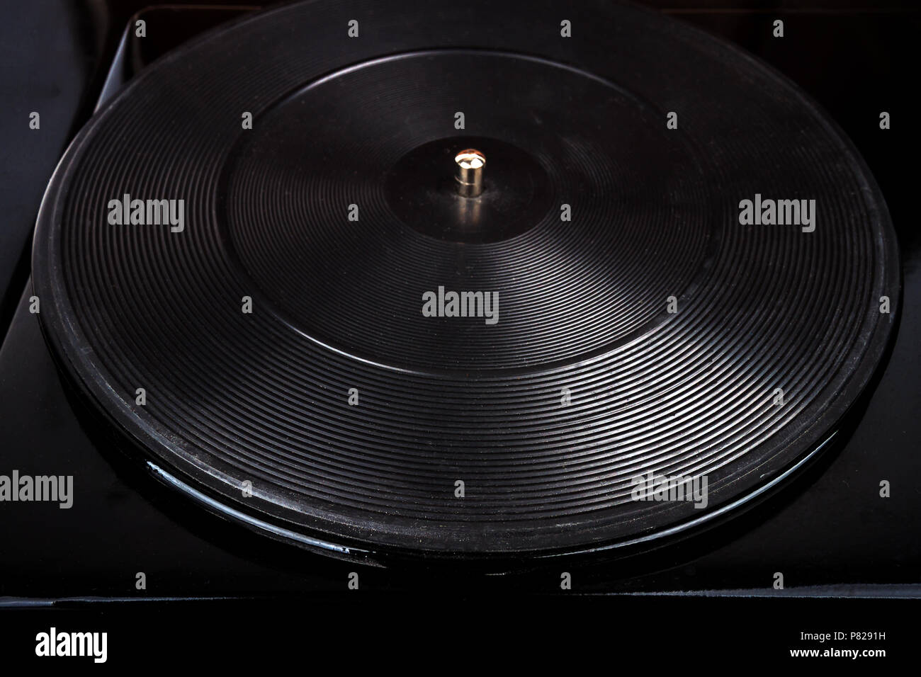 Close up shot of old turntable rubber platter with the spindle Stock ...