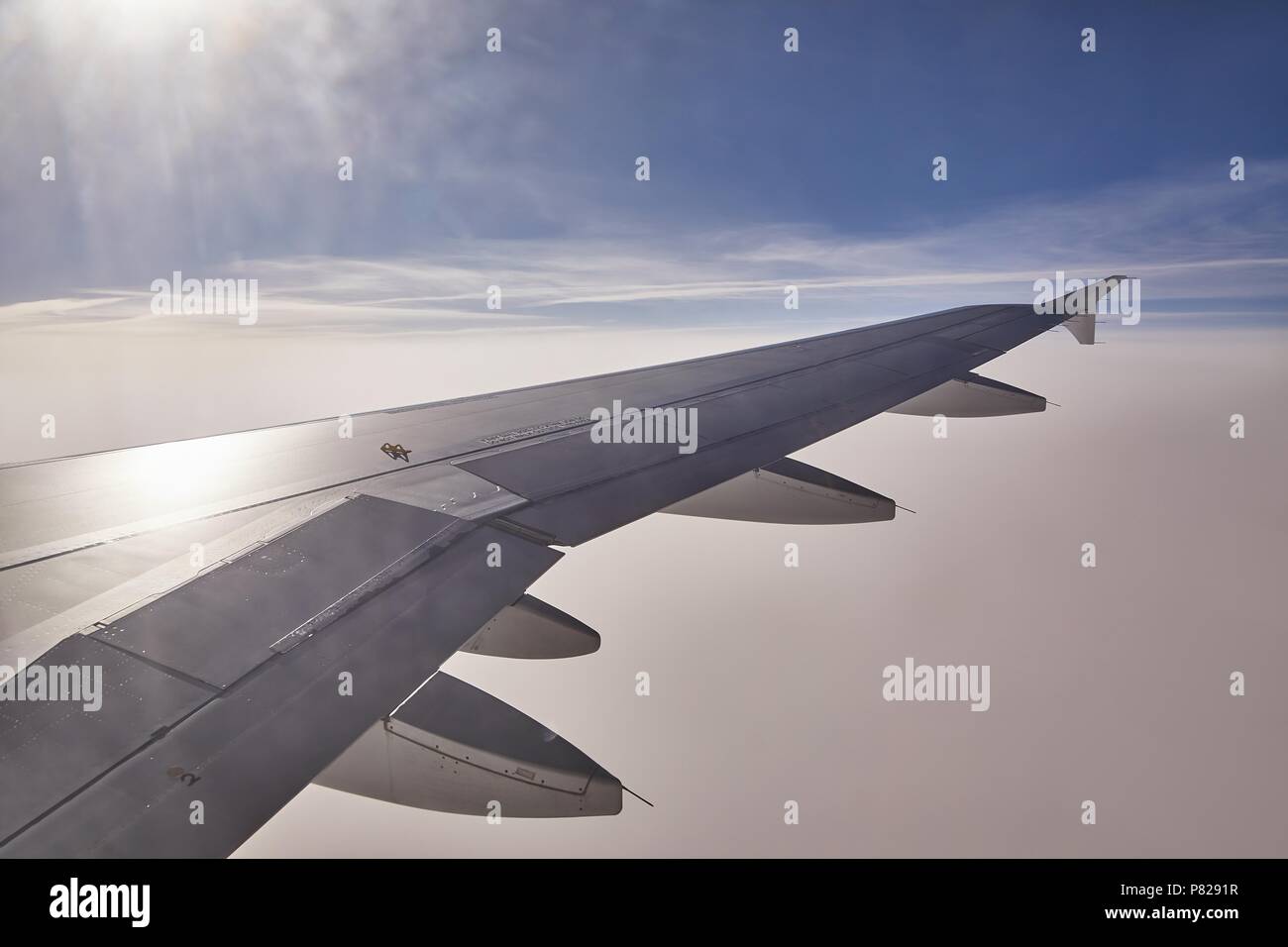 View from plane window with sun flare Stock Photo - Alamy