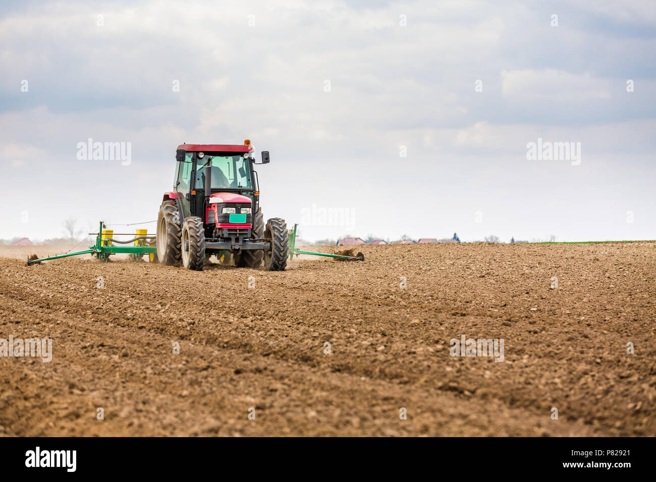 Farmer seeding, sowing crops at field. Sowing is the process of ...