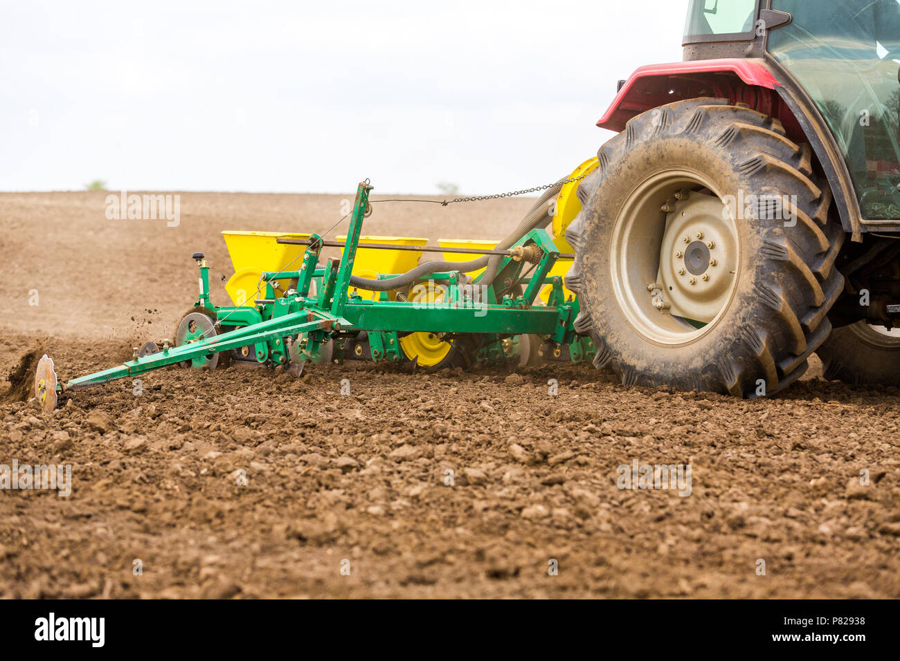 Farmer seeding, sowing crops at field. Sowing is the process of ...