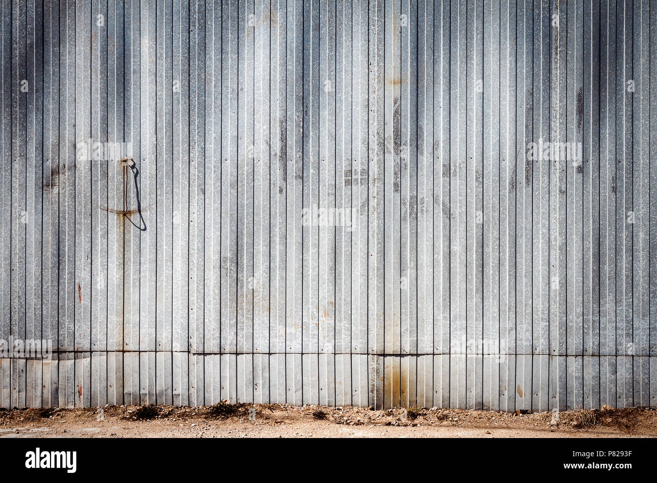 Old rusty metal warehouse wall. Architecture detail background. Metal ...