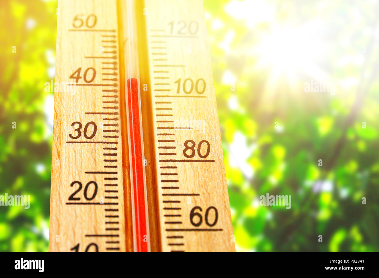 Thermometer displaying high 40 degree hot temperatures in sun summer ...