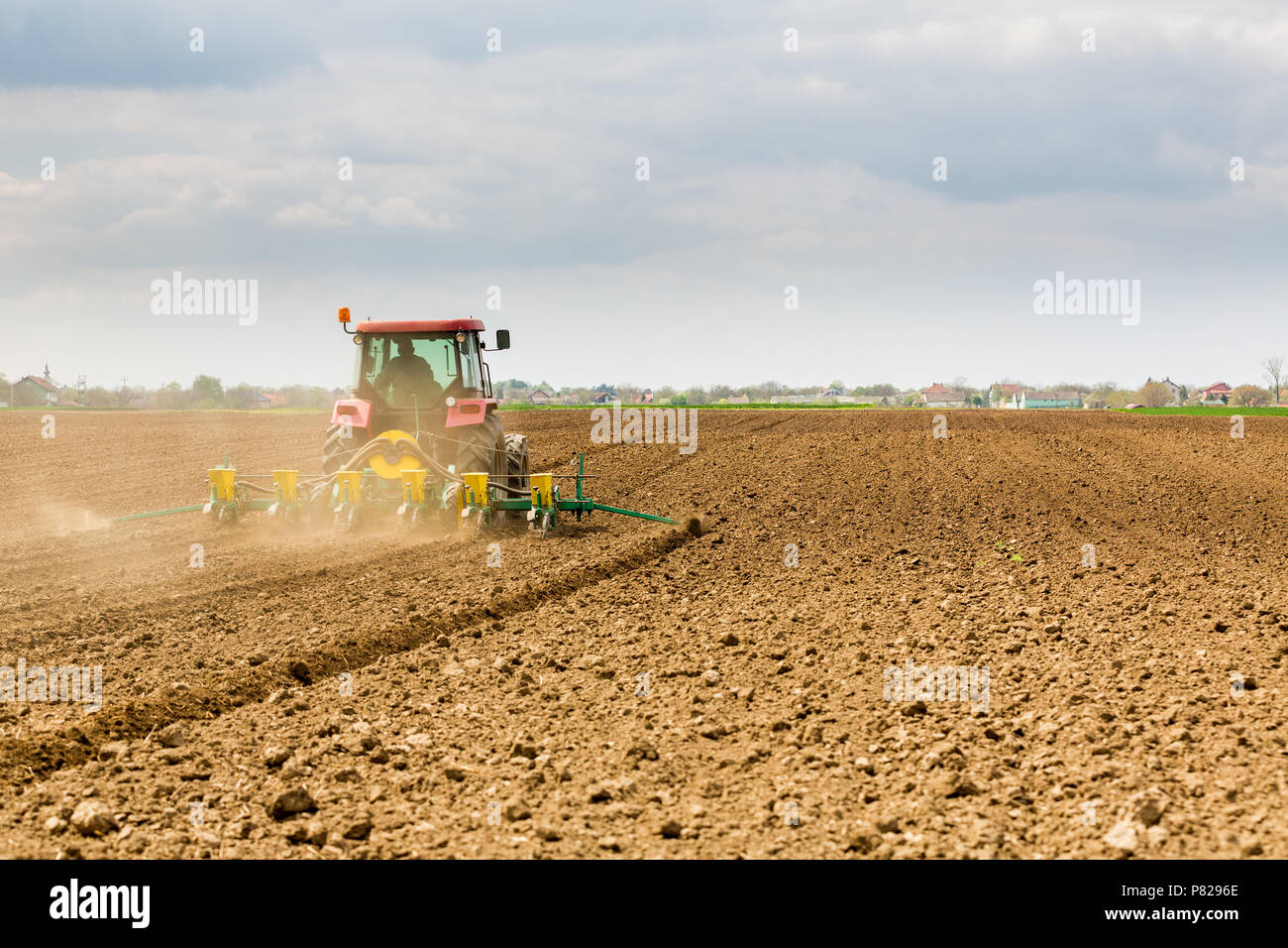Farmer seeding, sowing crops at field. Sowing is the process of ...