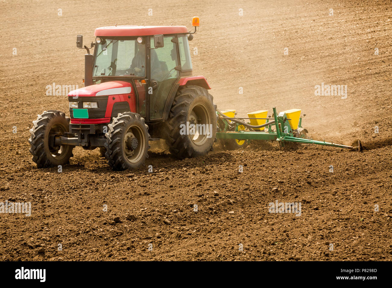 Farmer seeding, sowing crops at field. Sowing is the process of ...