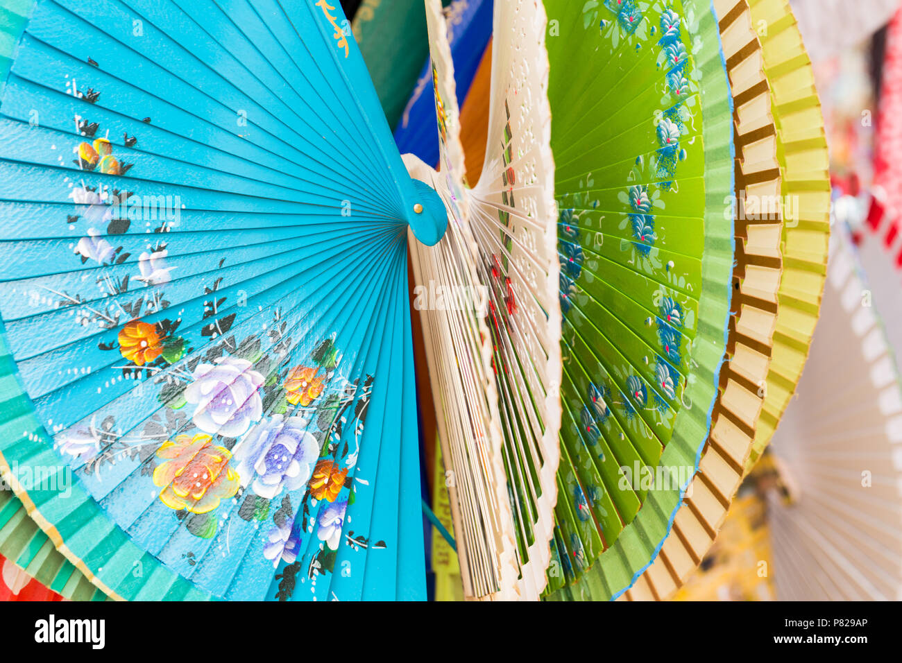 colorful fans for hot days, traditional for Mediterranean countries ...