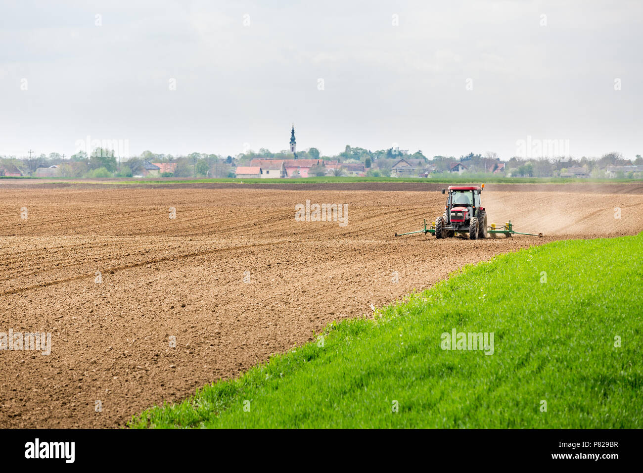 Farmer seeding, sowing crops at field. Sowing is the process of ...