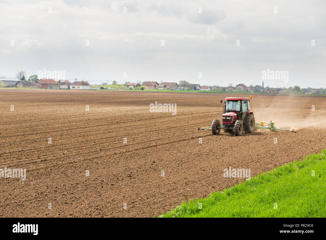 Farmer seeding, sowing crops at field. Sowing is the process of ...