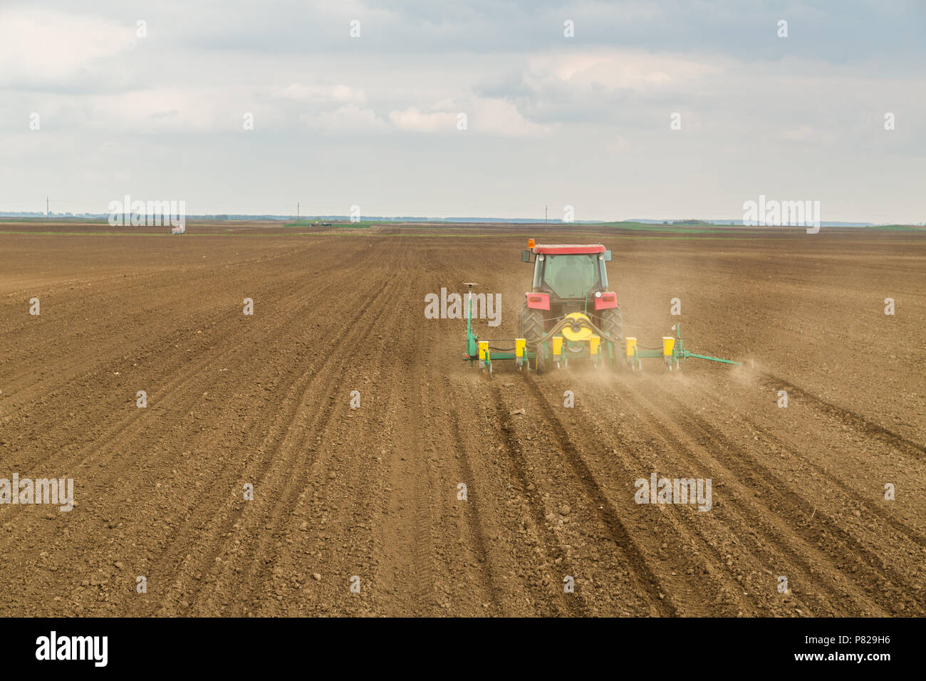 Farmer seeding, sowing crops at field. Sowing is the process of ...