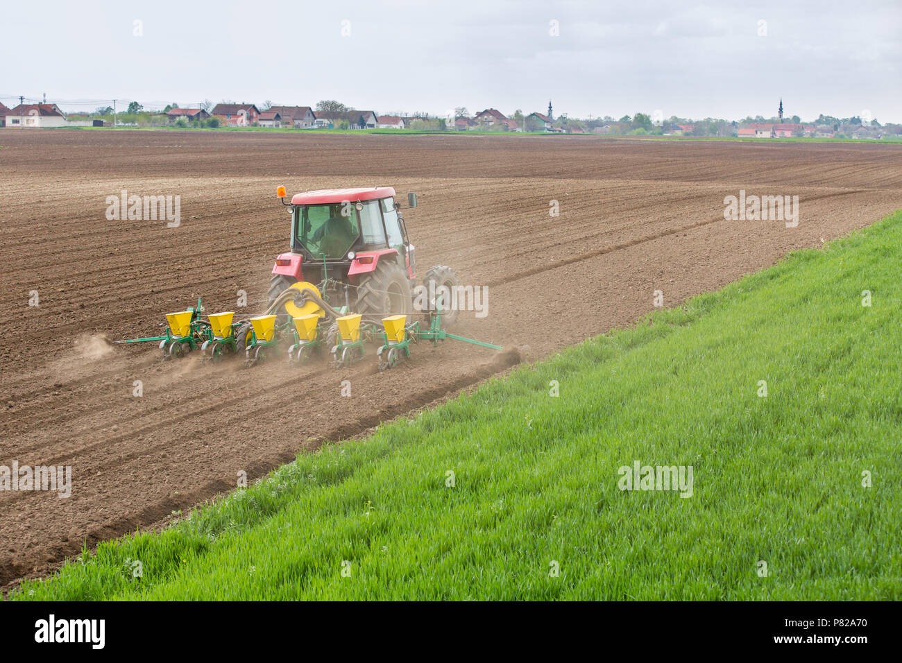 Farmer seeding, sowing crops at field. Sowing is the process of ...