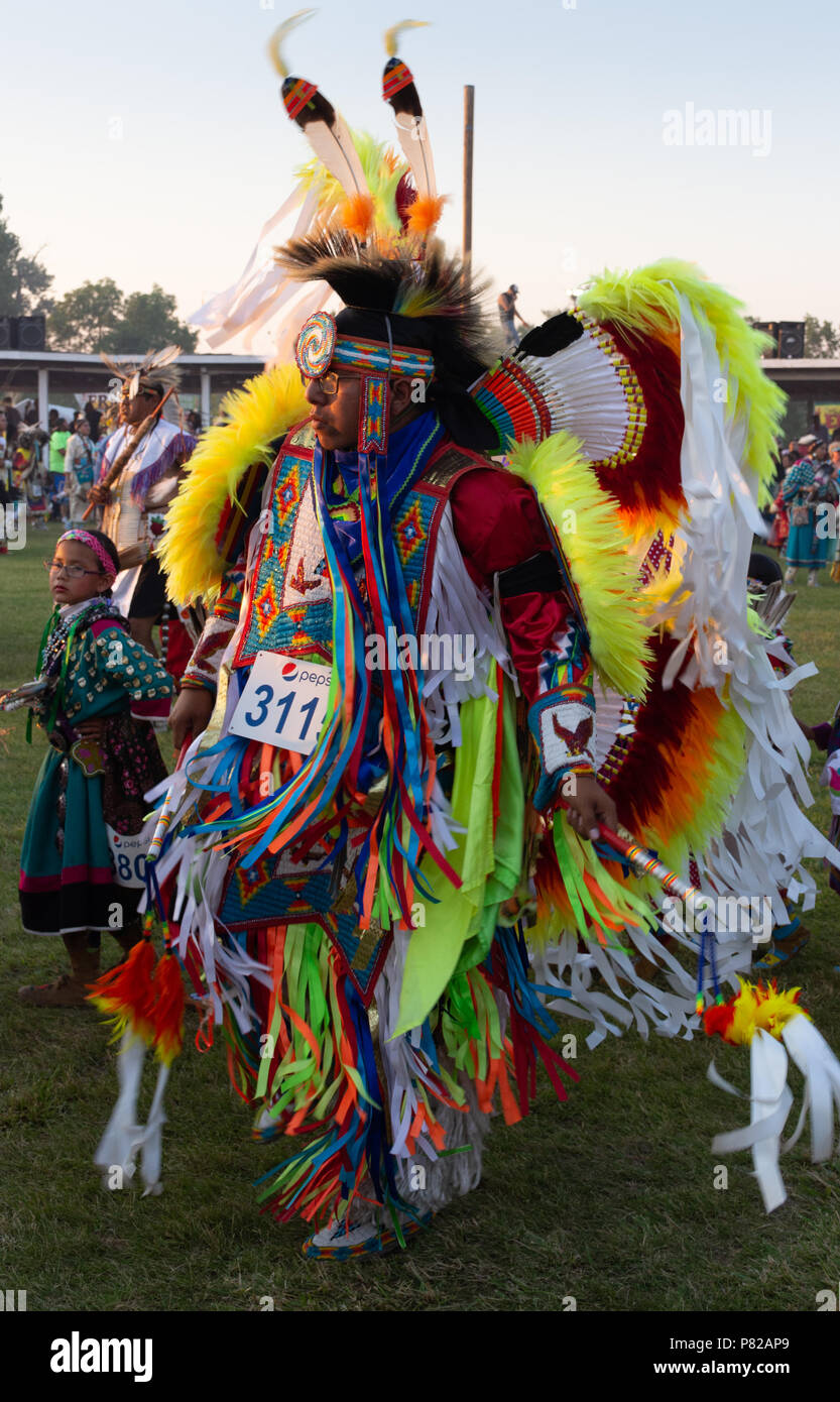 A Native American Dancing in Neon Yellow, Green and Orange Ceremonial ...