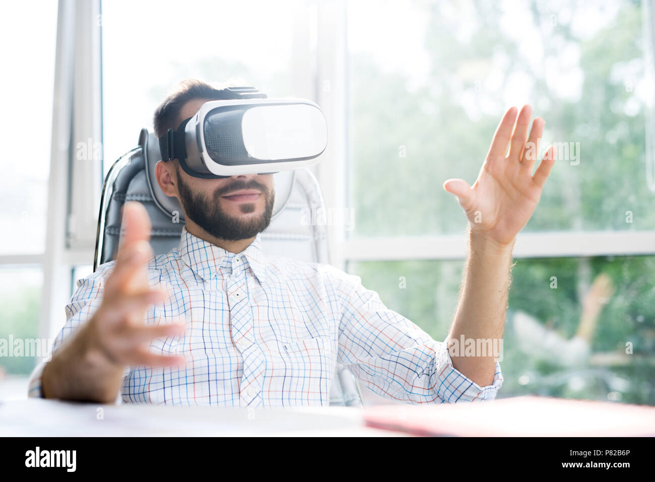 Successful young man using virtual hi-res stock photography and images ...