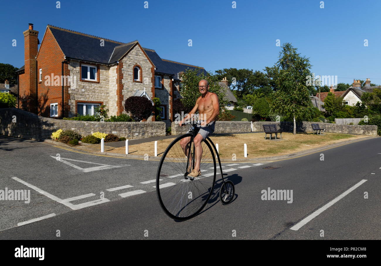 Riding a penny farthing hi-res stock photography and images - Alamy