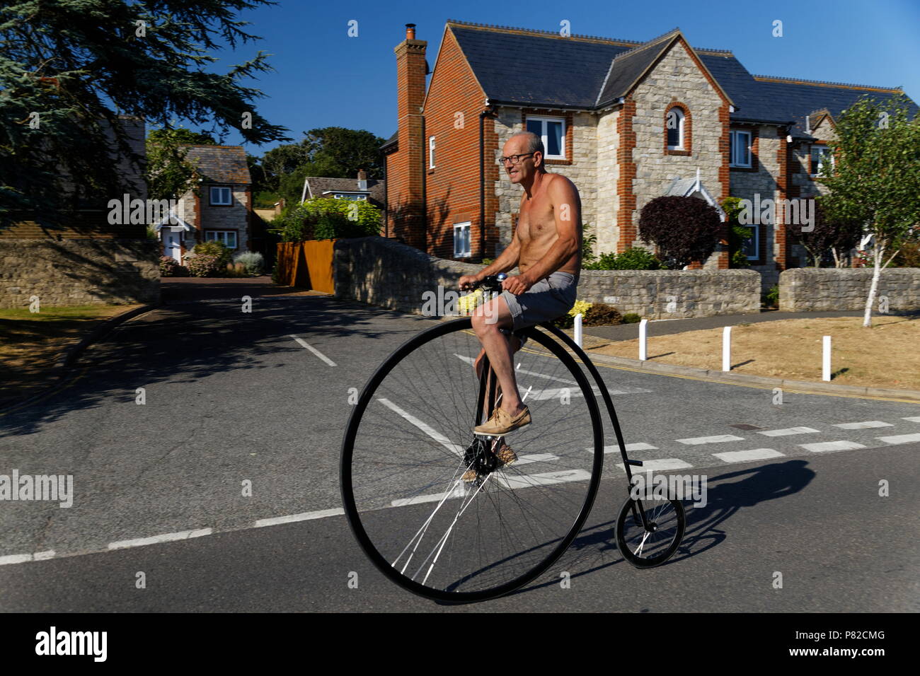Riding a penny farthing hi-res stock photography and images - Alamy
