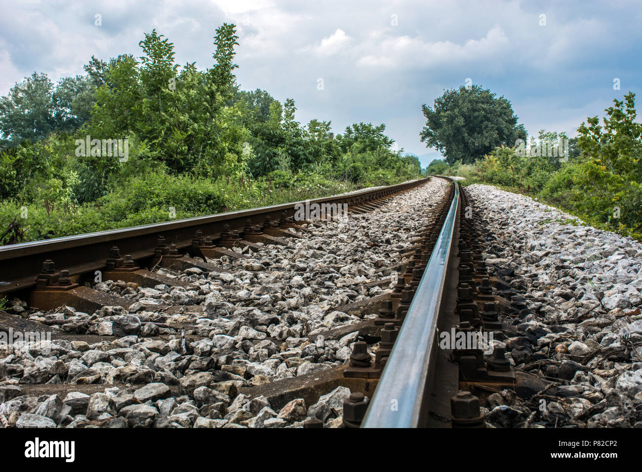 Long Railroad against beautiful blue cloudy sky in nature. Railway ...