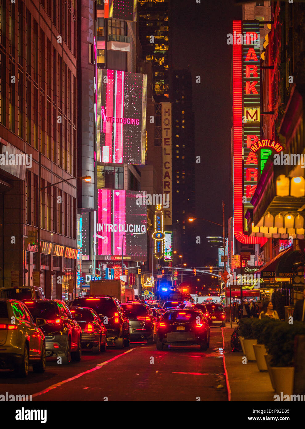 Nighttime on the streets of Manhattan, close to TImes Square with the ...