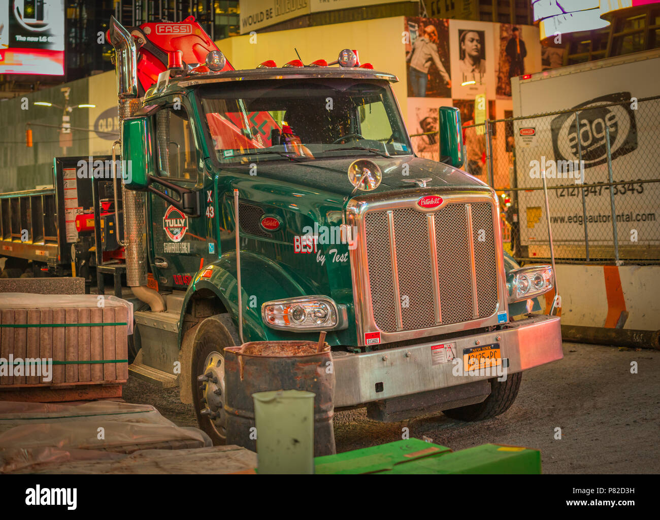 Robust green building truck, pictured at night on a building site in ...